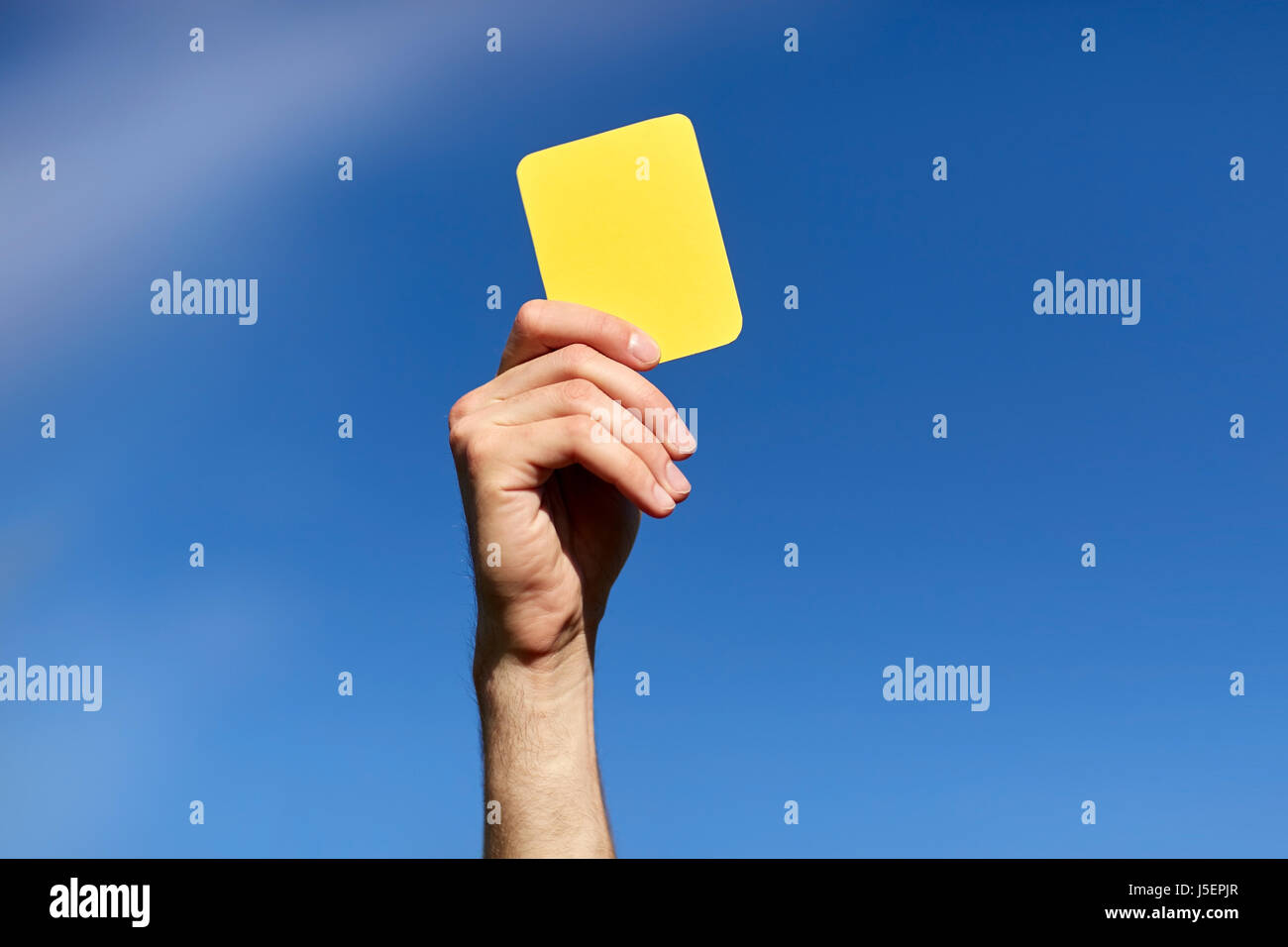 Referee hand yellow card hi-res stock photography and images - Alamy