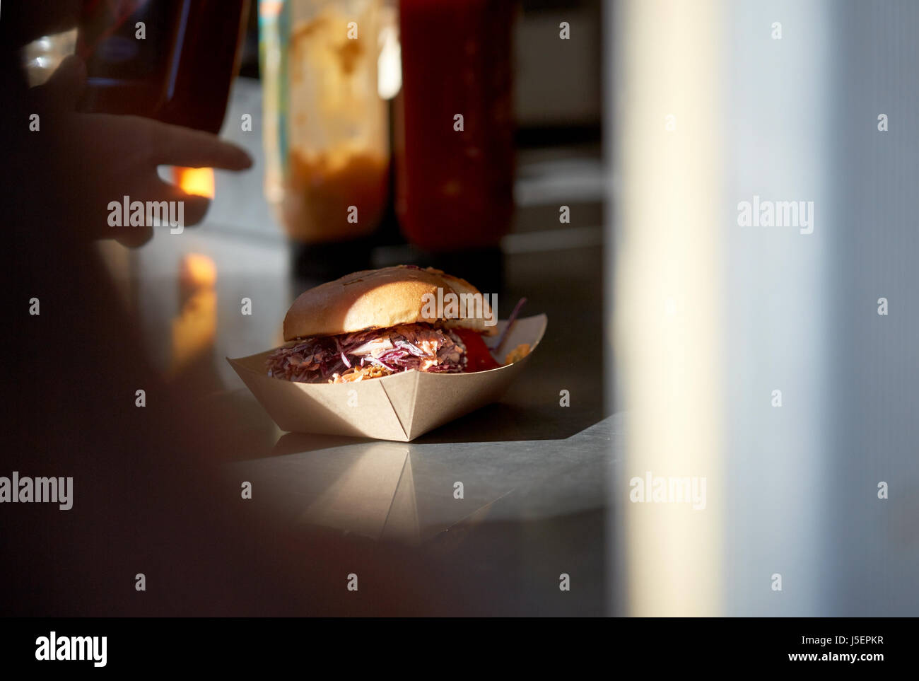 hamburger in disposable paper plate on table Stock Photo - Alamy