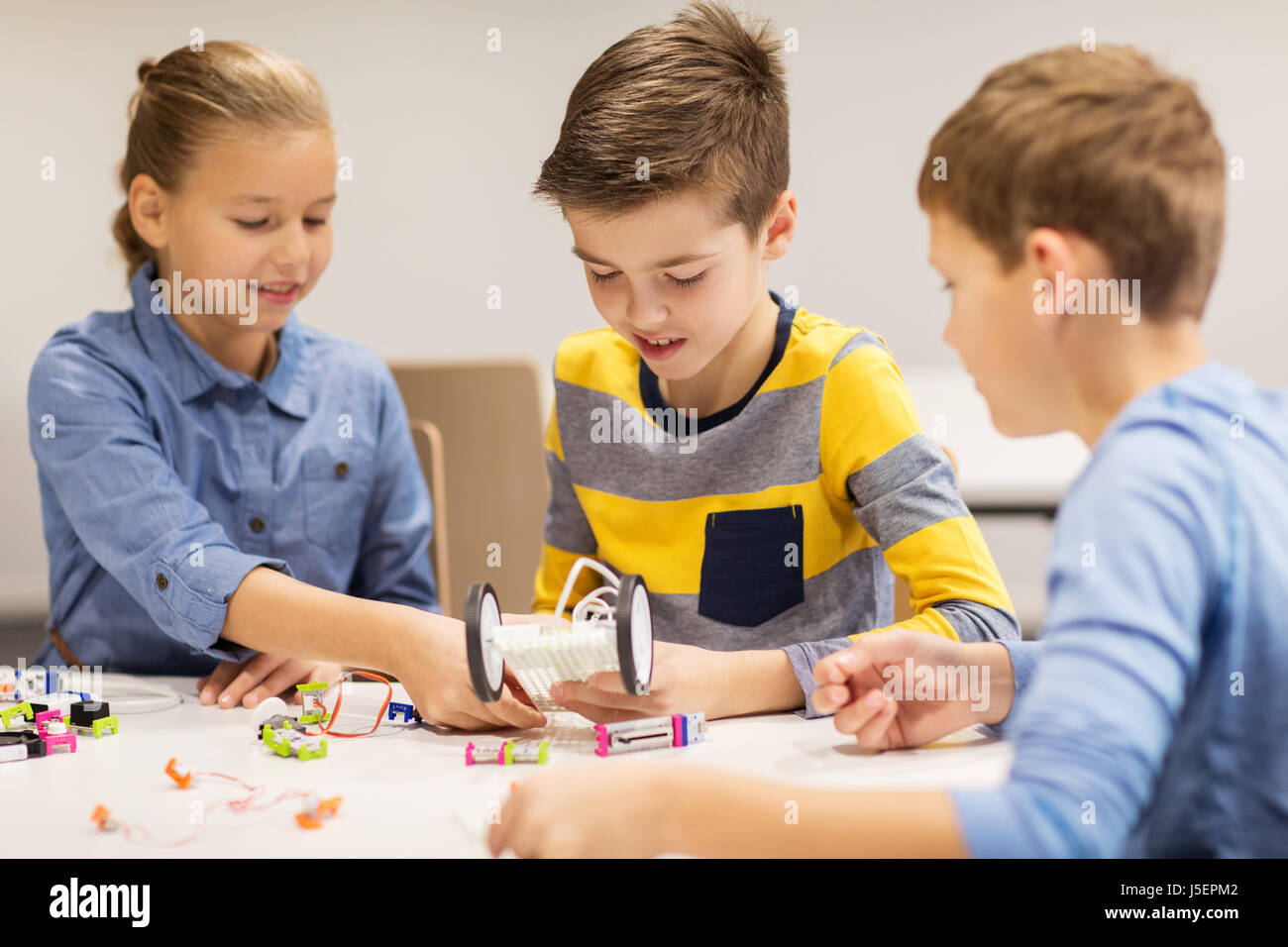 happy children building robots at robotics school Stock Photo - Alamy