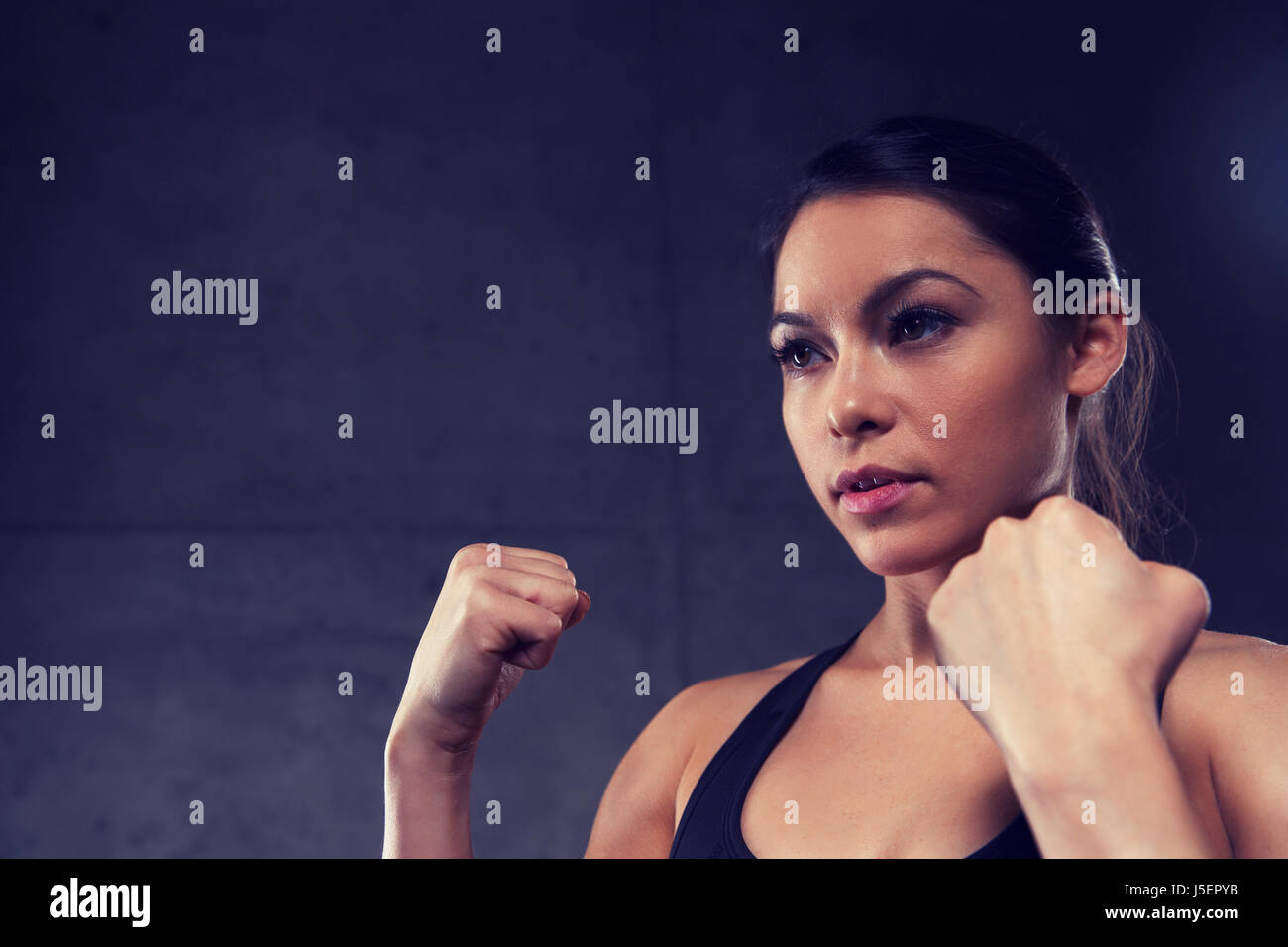woman holding fists and fighting in gym Stock Photo - Alamy