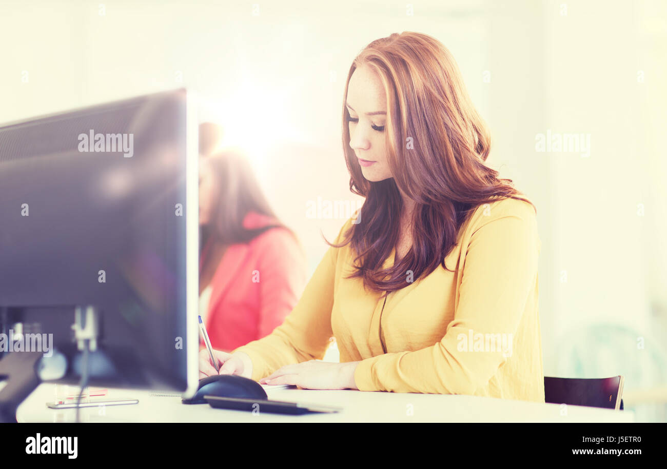 creative female office worker writing to notebook Stock Photo - Alamy