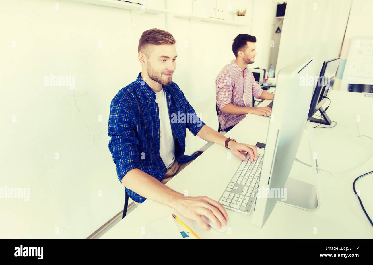creative man or student with computer at office Stock Photo - Alamy