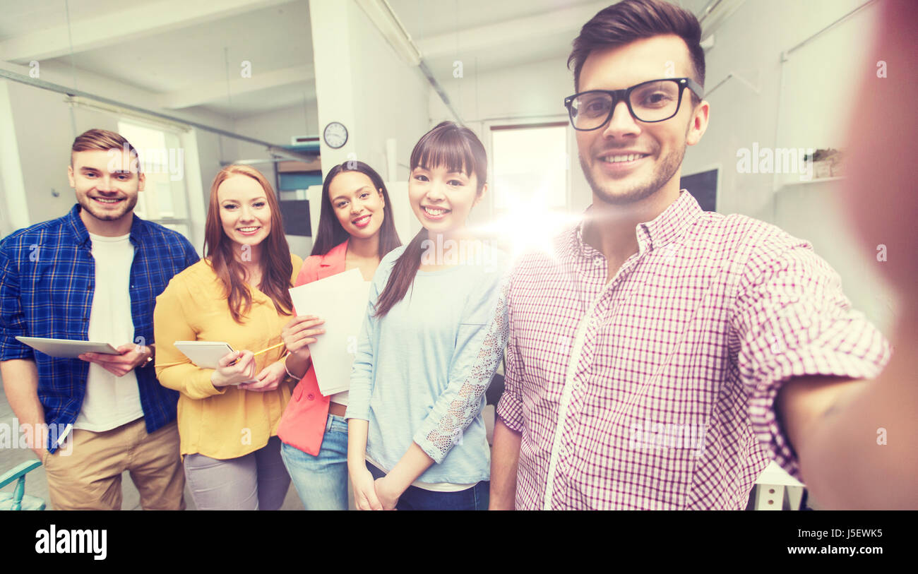 creative business team taking selfie at office Stock Photo - Alamy