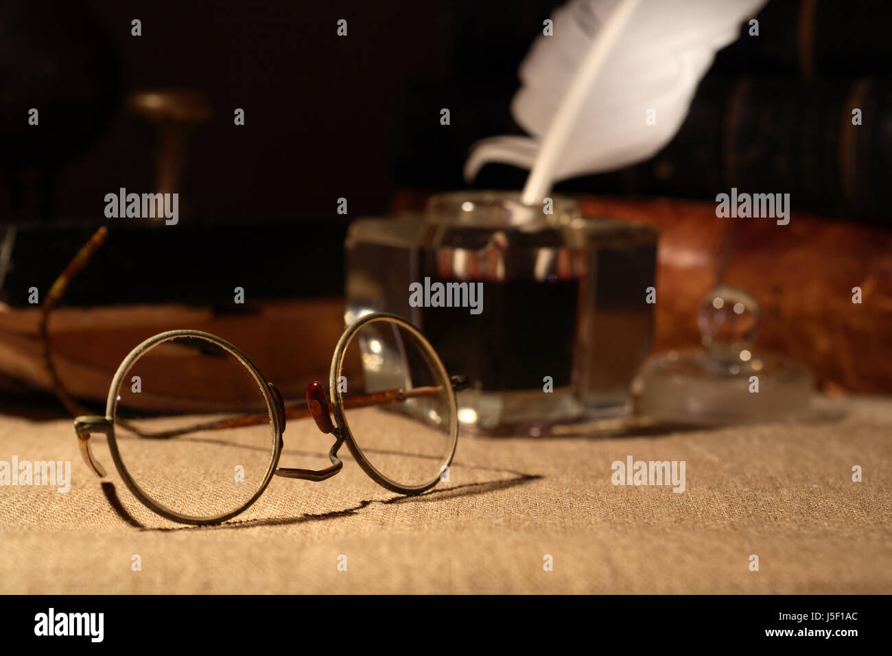 Vintage still life. Old spectacles closeup on dark background with ...