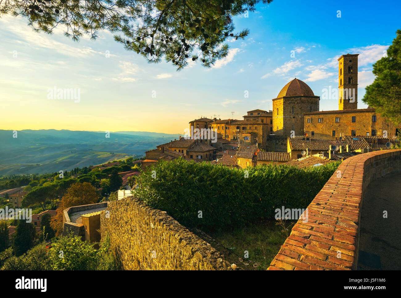 Tuscany, Volterra town skyline, church and trees on sunset. Maremma ...