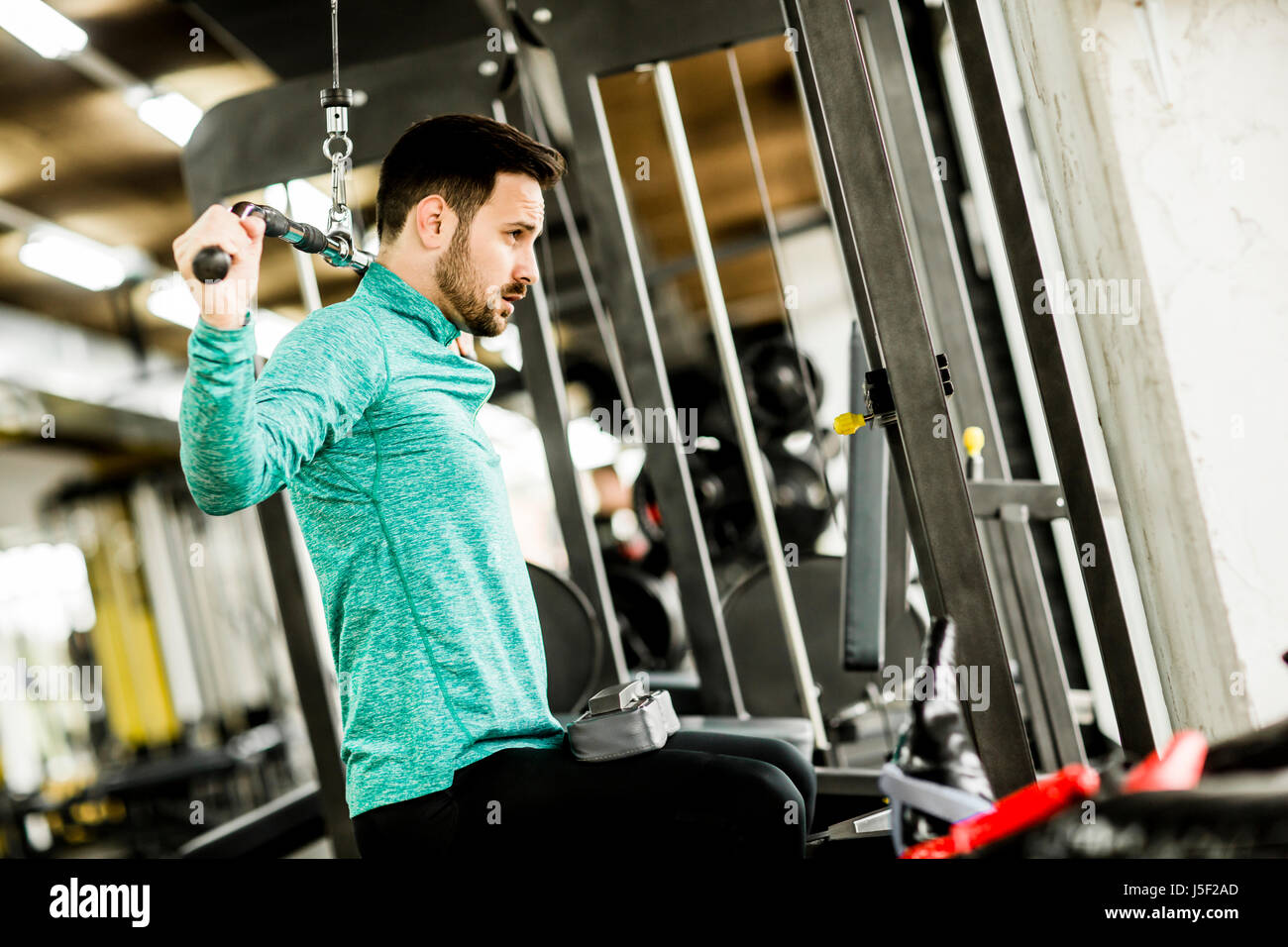 Strong young guy doing triceps hi-res stock photography and images - Alamy