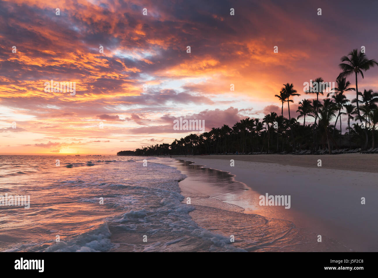 Colorful tropical sunrise over Atlantic Ocean coast, Bavaro beach ...