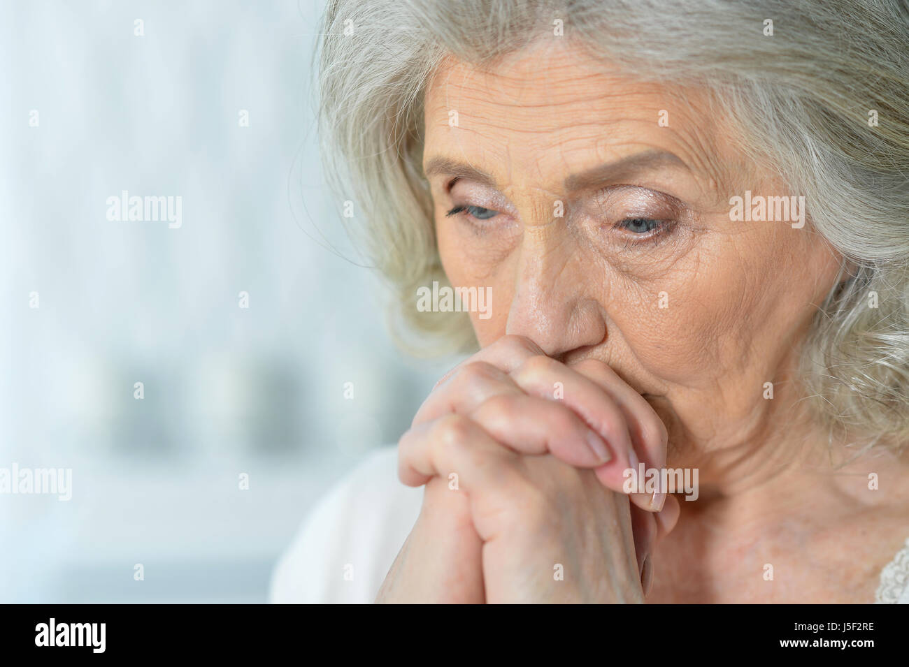 Beautiful sad elderly woman Stock Photo - Alamy