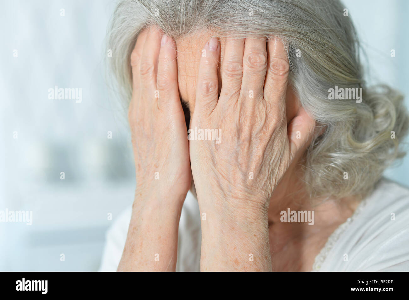 Beautiful sad elderly woman Stock Photo - Alamy