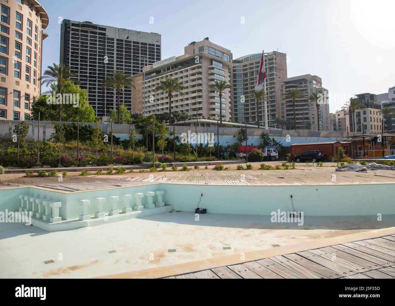 Empty pool in front of luxury residential buildings on the corniche ...