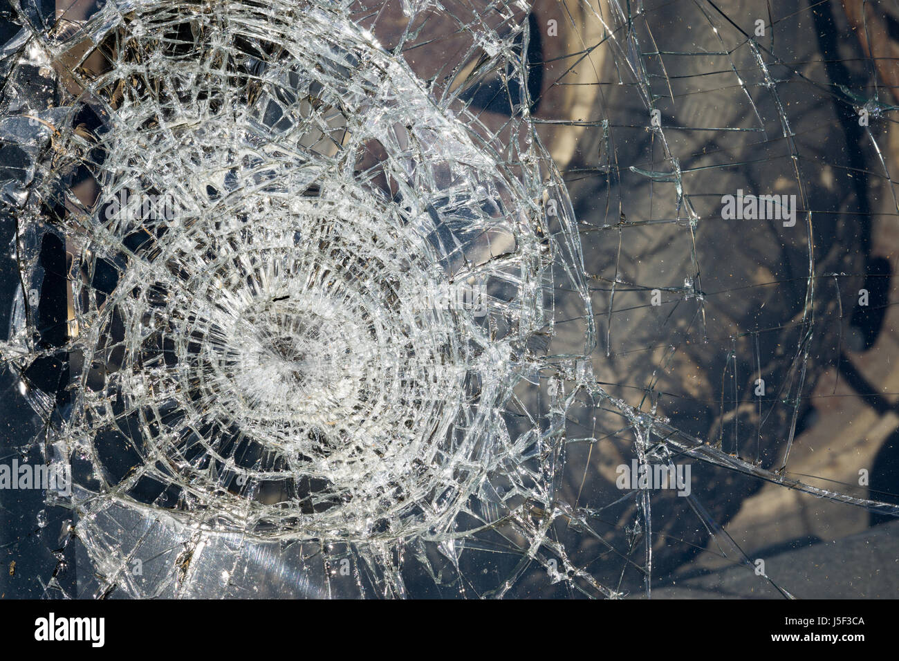 Broken bullet windshield glass hole damage hi-res stock photography and ...
