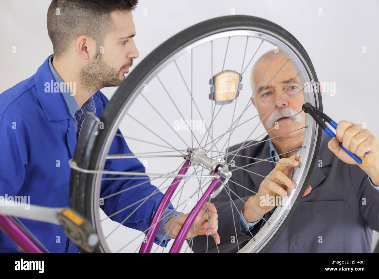demonstration on how to repair a bike rim Stock Photo - Alamy
