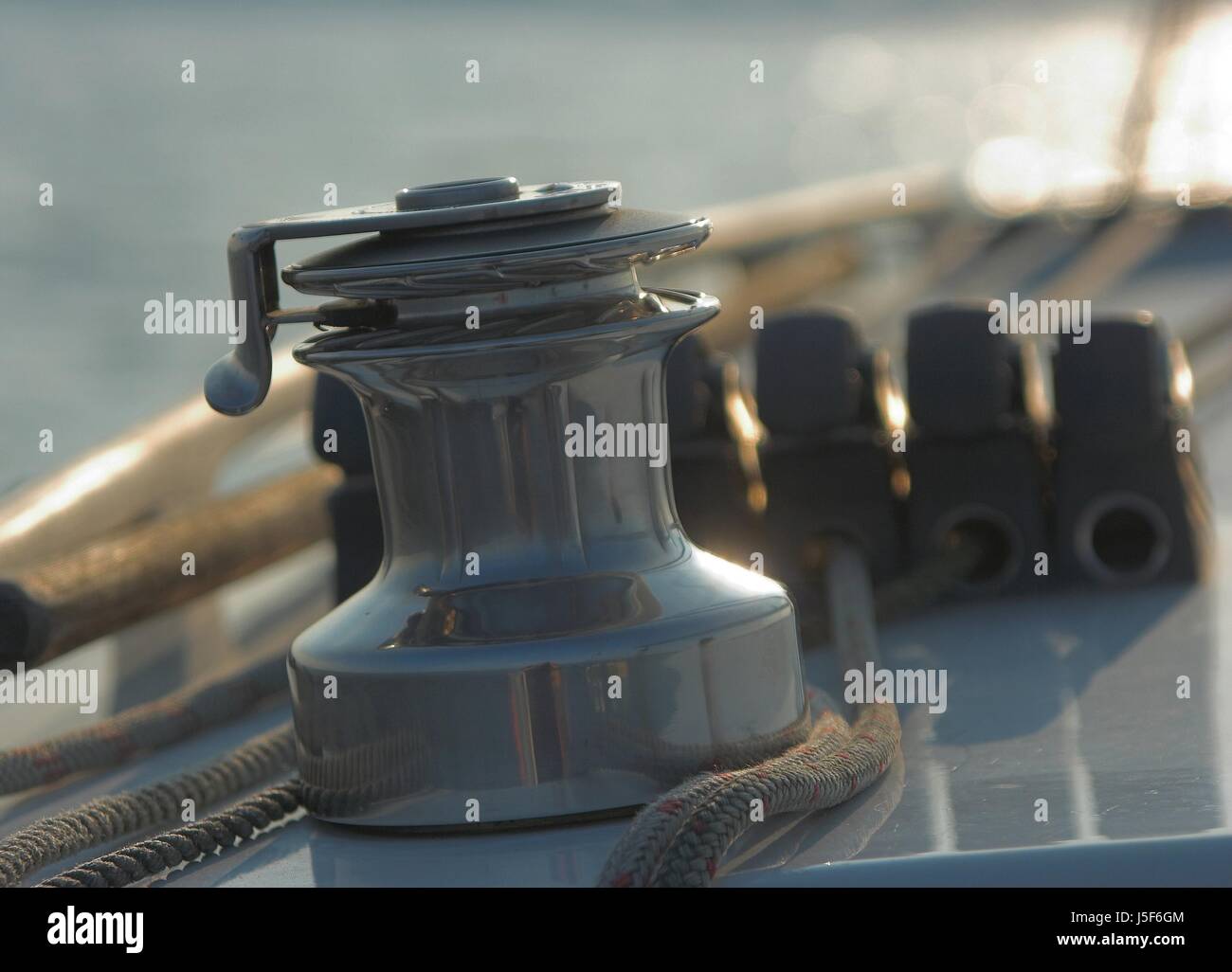 seafaring sail drop yacht winch sheet ropes linen bare tear down gear ...