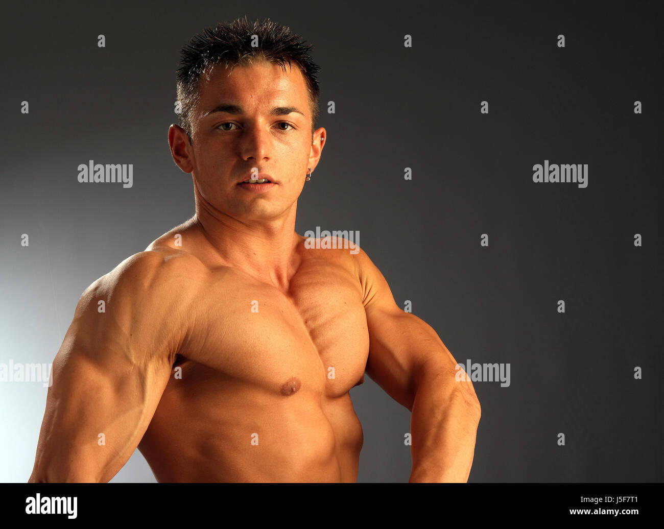 muscles sporty athletic wiry pithy heavyset tight sporting pose ...