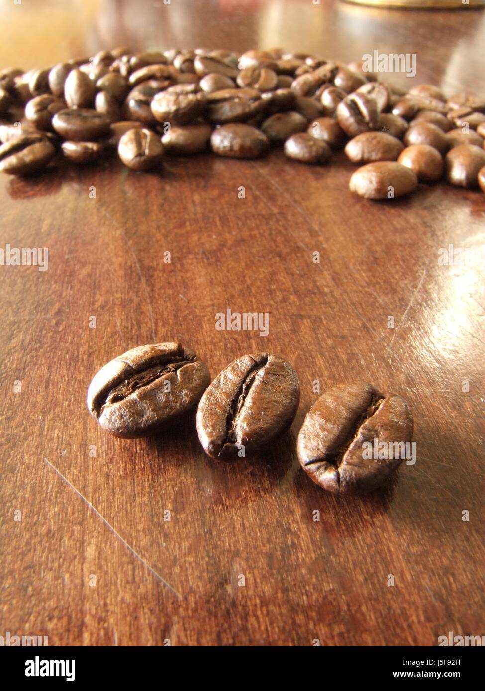 three coffee beans Stock Photo - Alamy
