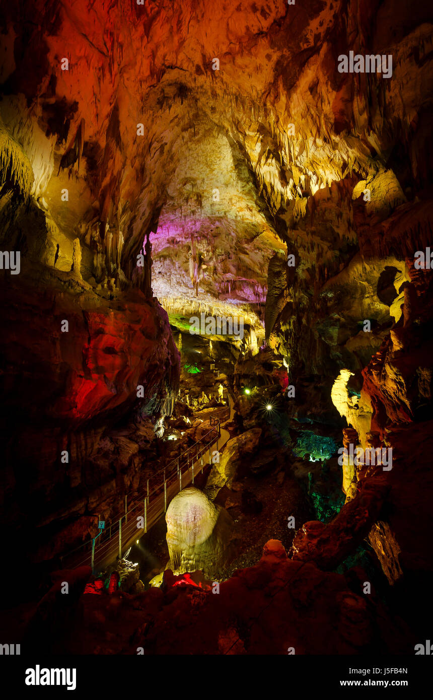 Beautiful illuminated multicolored cave and stalactites from karst ...