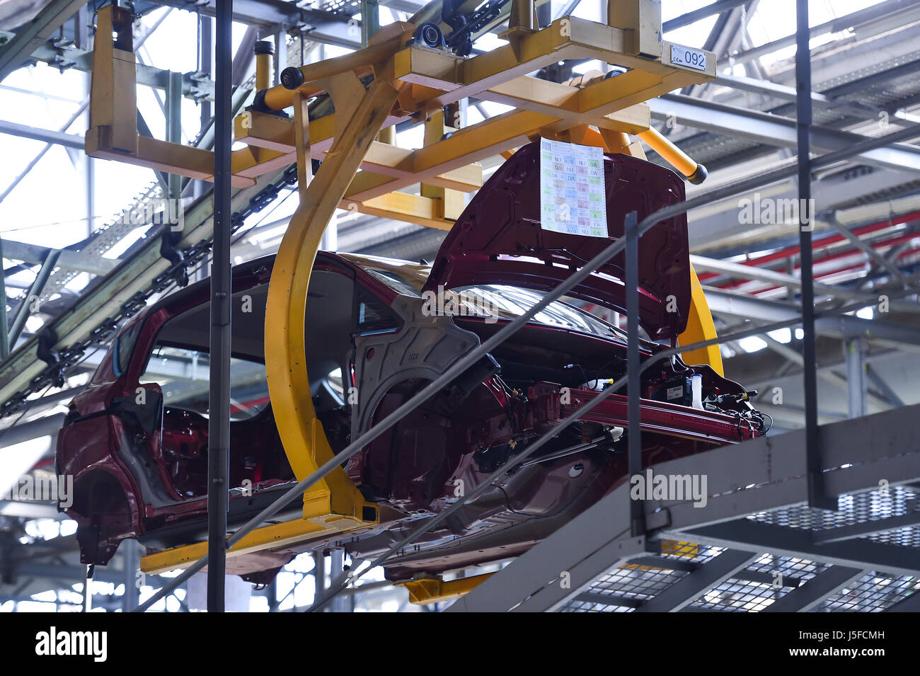 Car bodies on the production line inside automobile factory Stock Photo ...