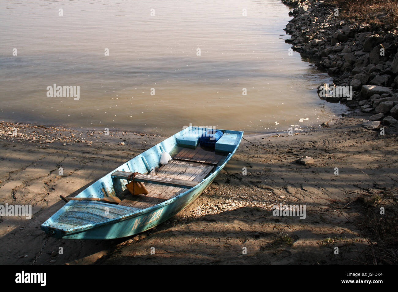 blue danube aground muddily current of the river bank river water ...
