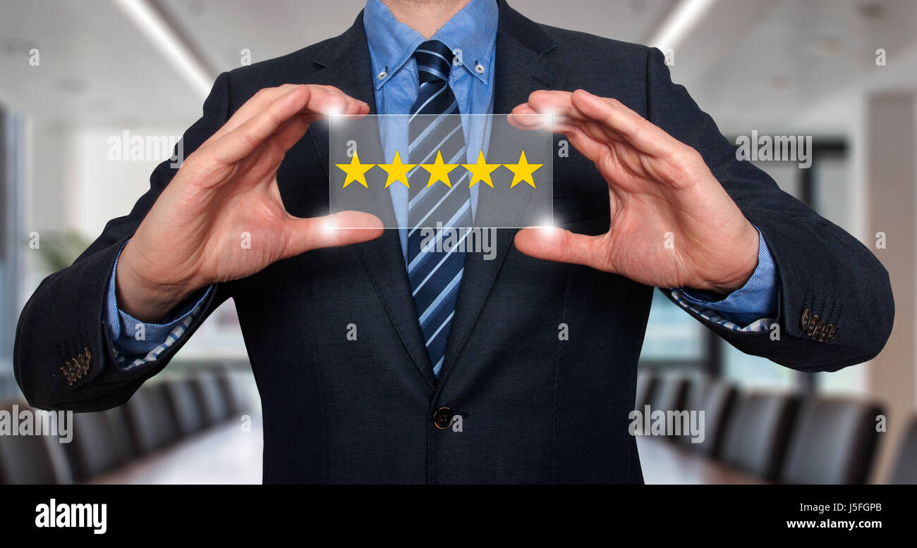 Businessman holding five star rating. Office - Stock Image Stock Photo ...