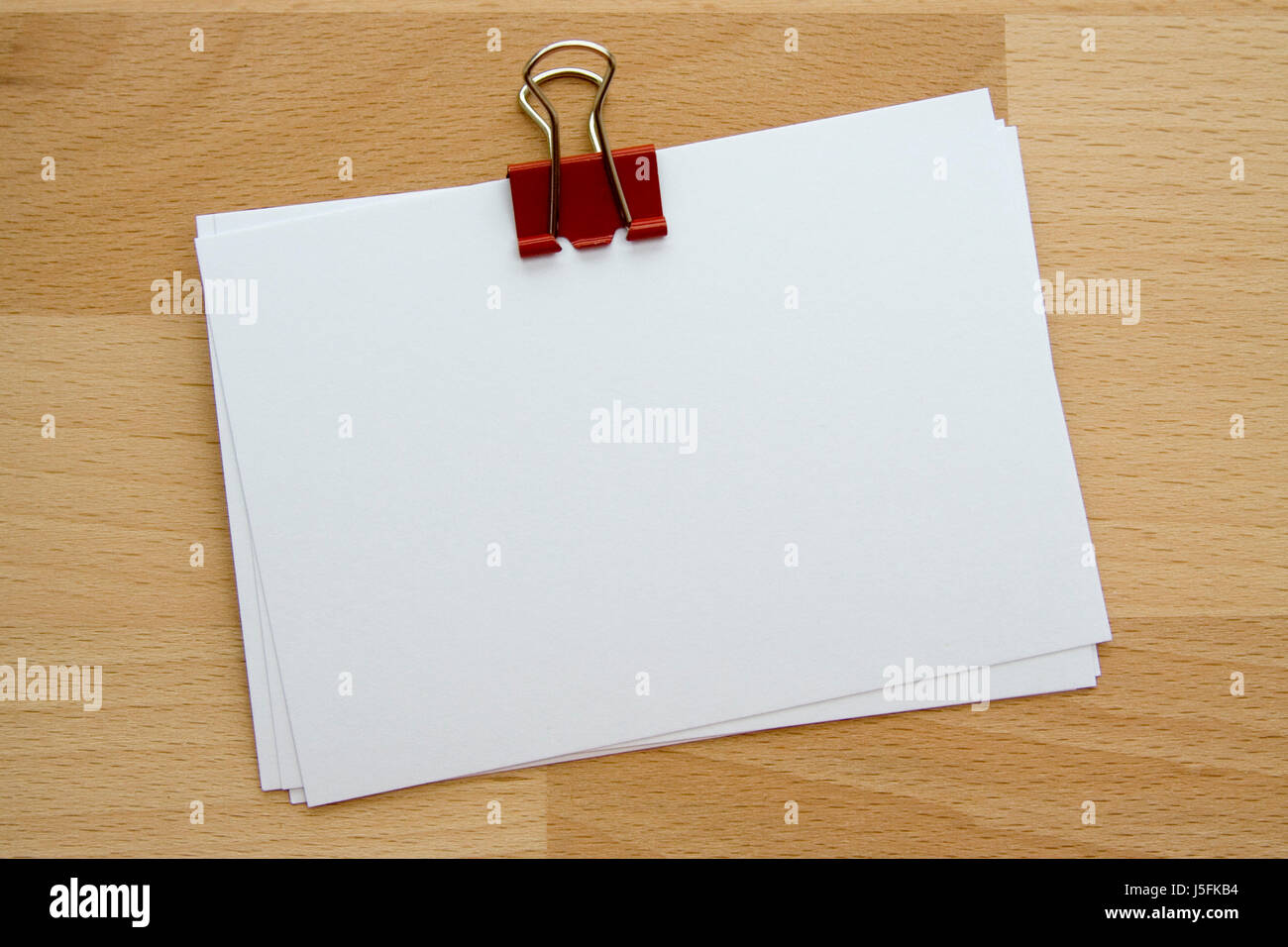 stapled notes on the desk Stock Photo - Alamy