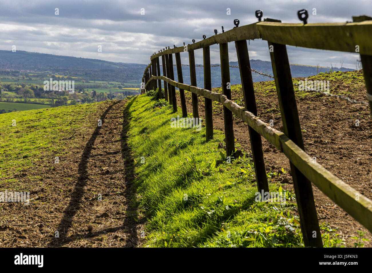 Timber and Barbed Wire fence running alongside a footpath Stock Photo ...