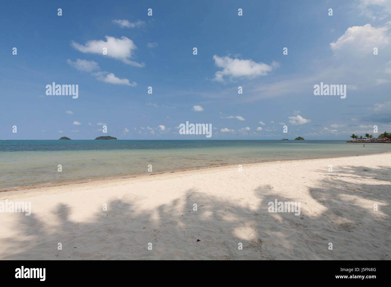 Shadow on the beach with blu sky Stock Photo - Alamy