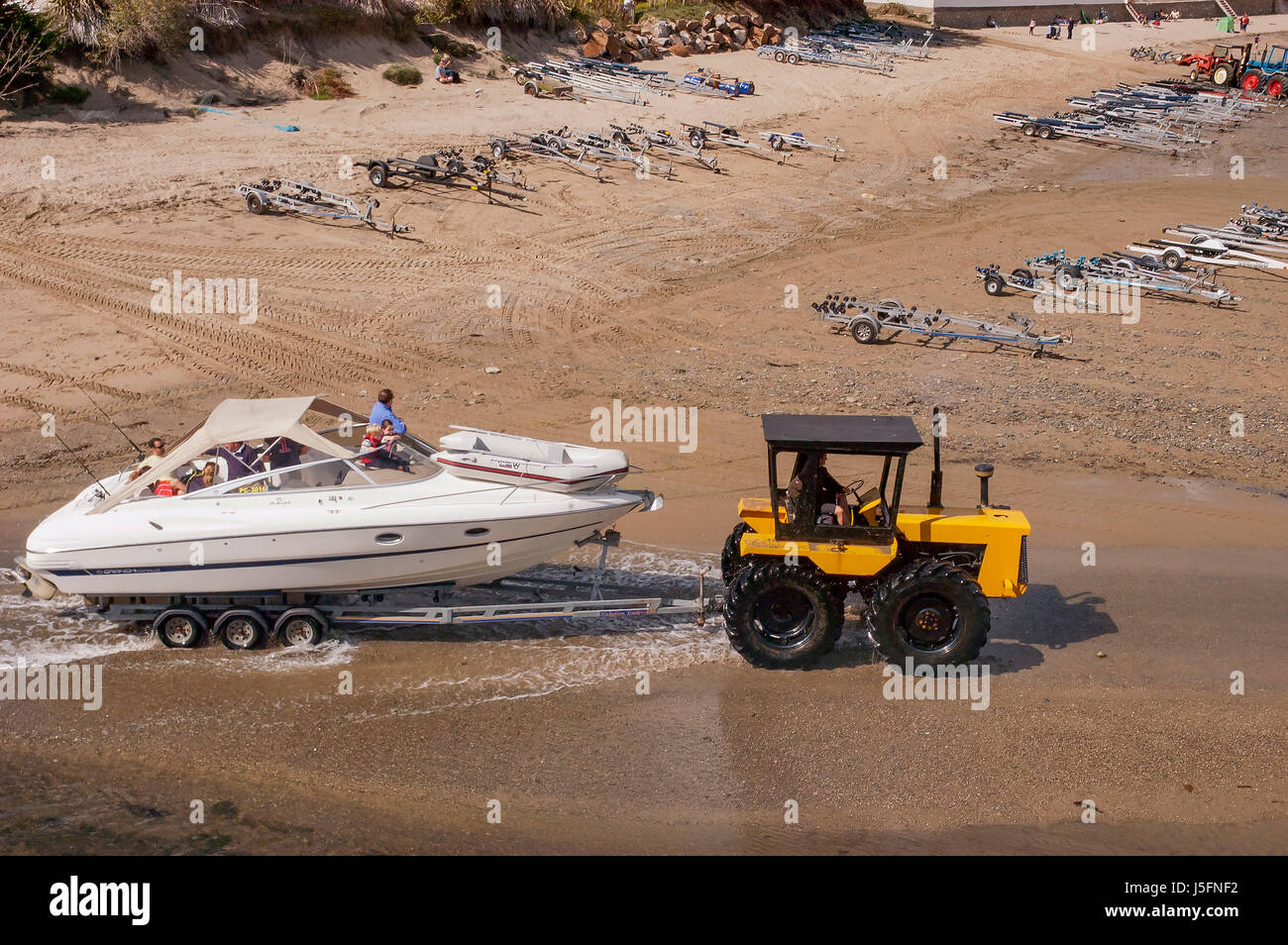 Abersoch beach. Speedboat launch tractor Stock Photo - Alamy