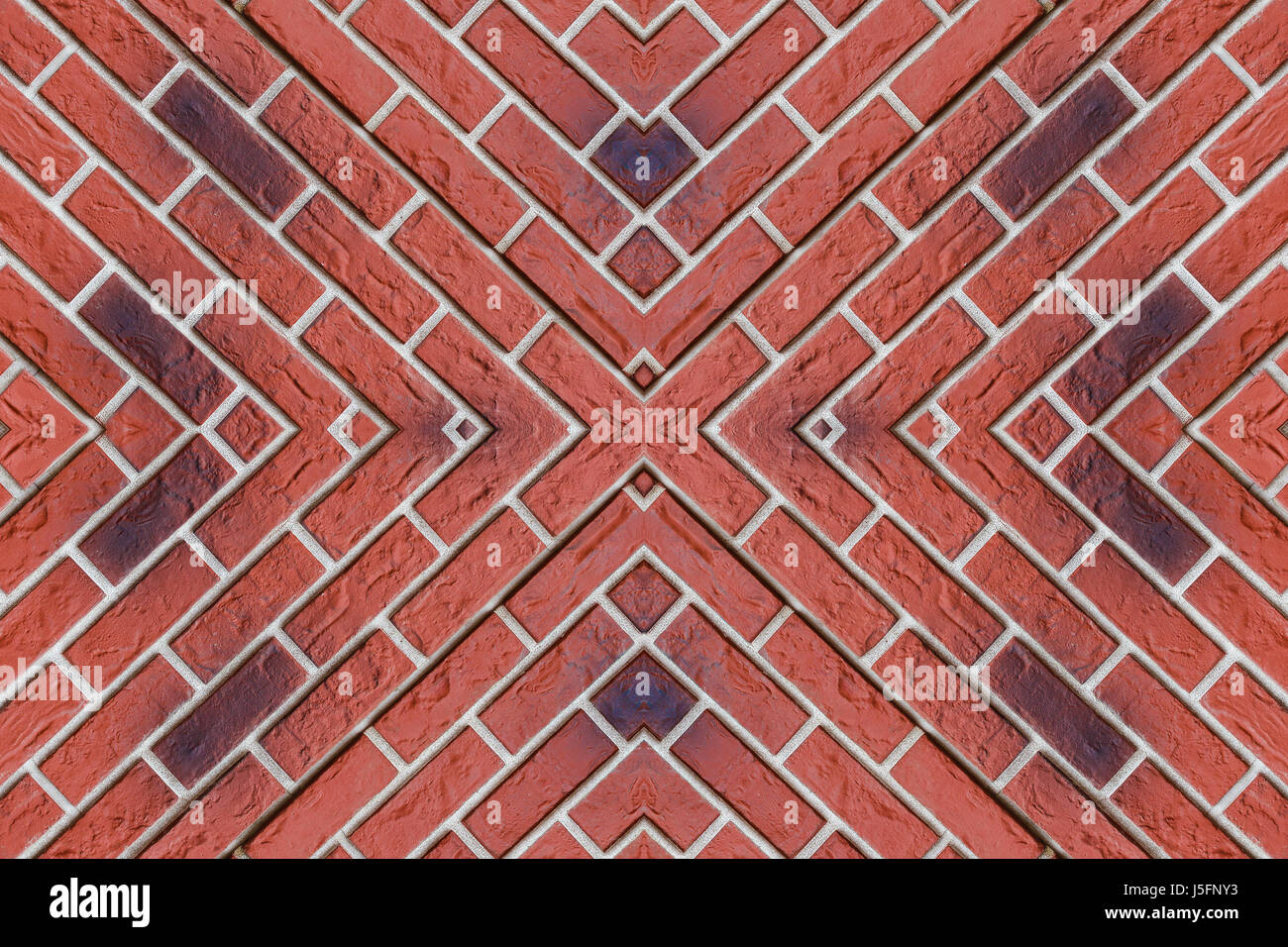 Wall of red brick. Bricks lined in the shape of a pattern and converge ...
