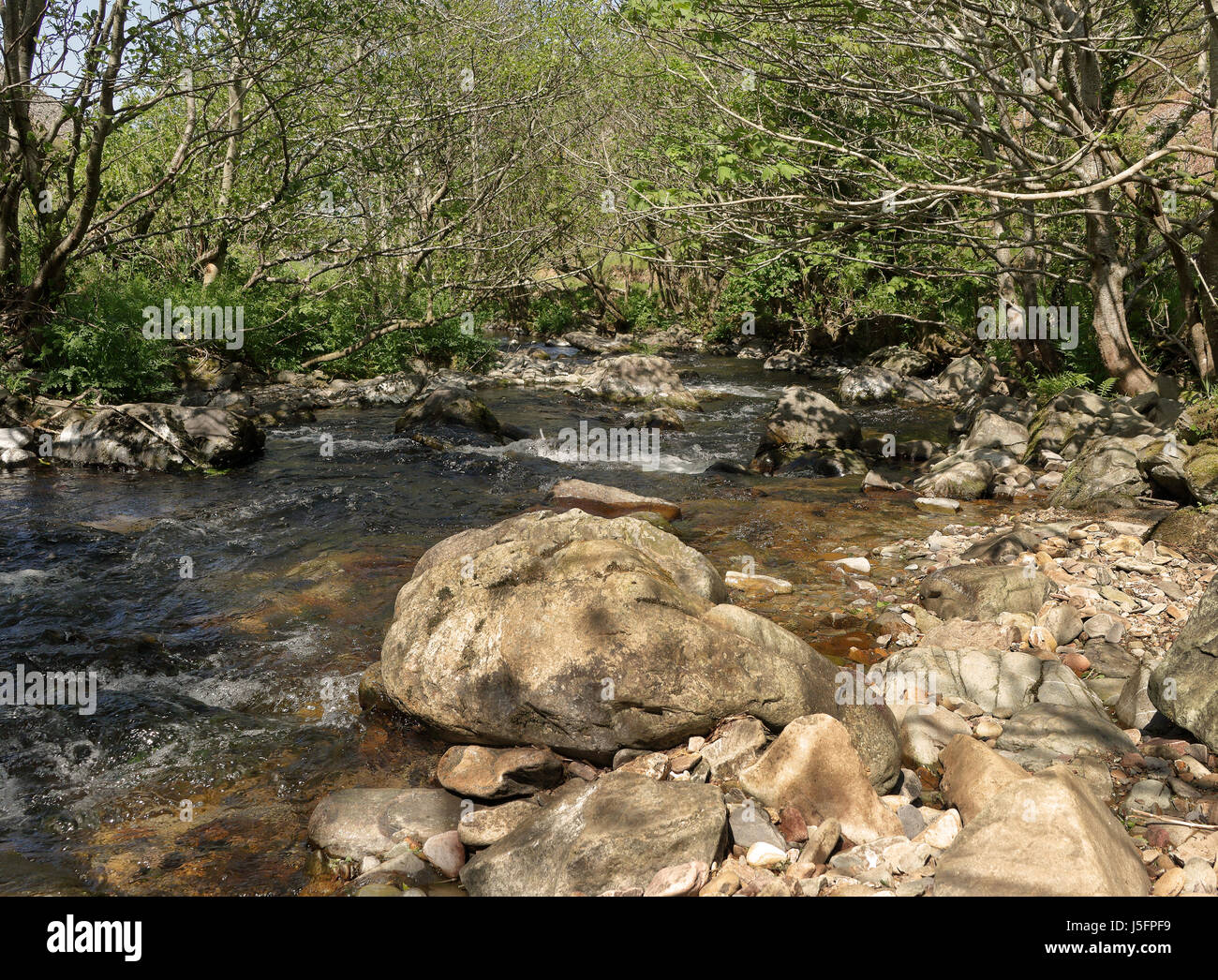 River Heddon flowing to the sea at Heddon's Mouth in North Devon Stock ...