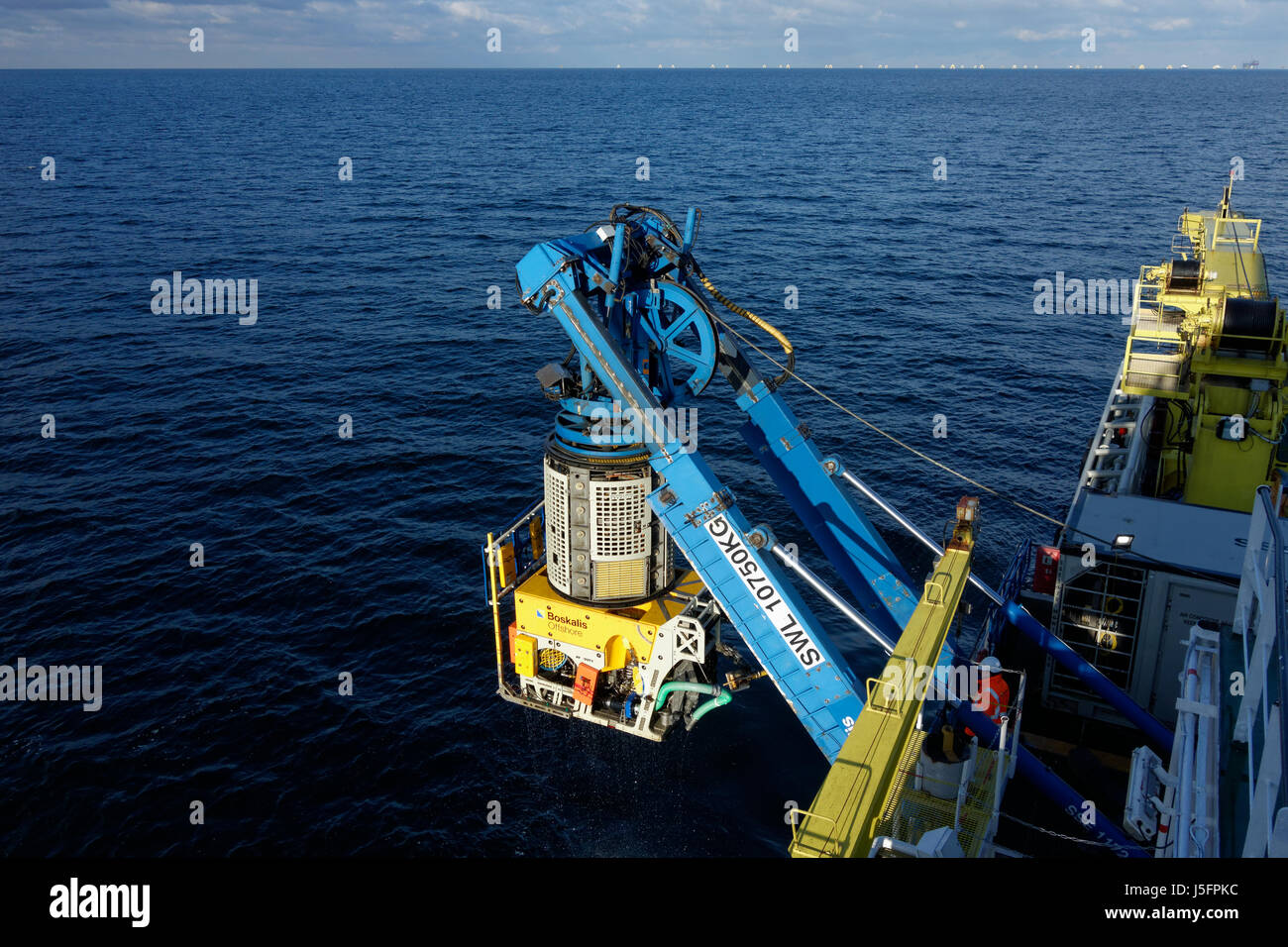 A Remotely Operated Vehicle (ROV) is deployed from a vessel in the ...