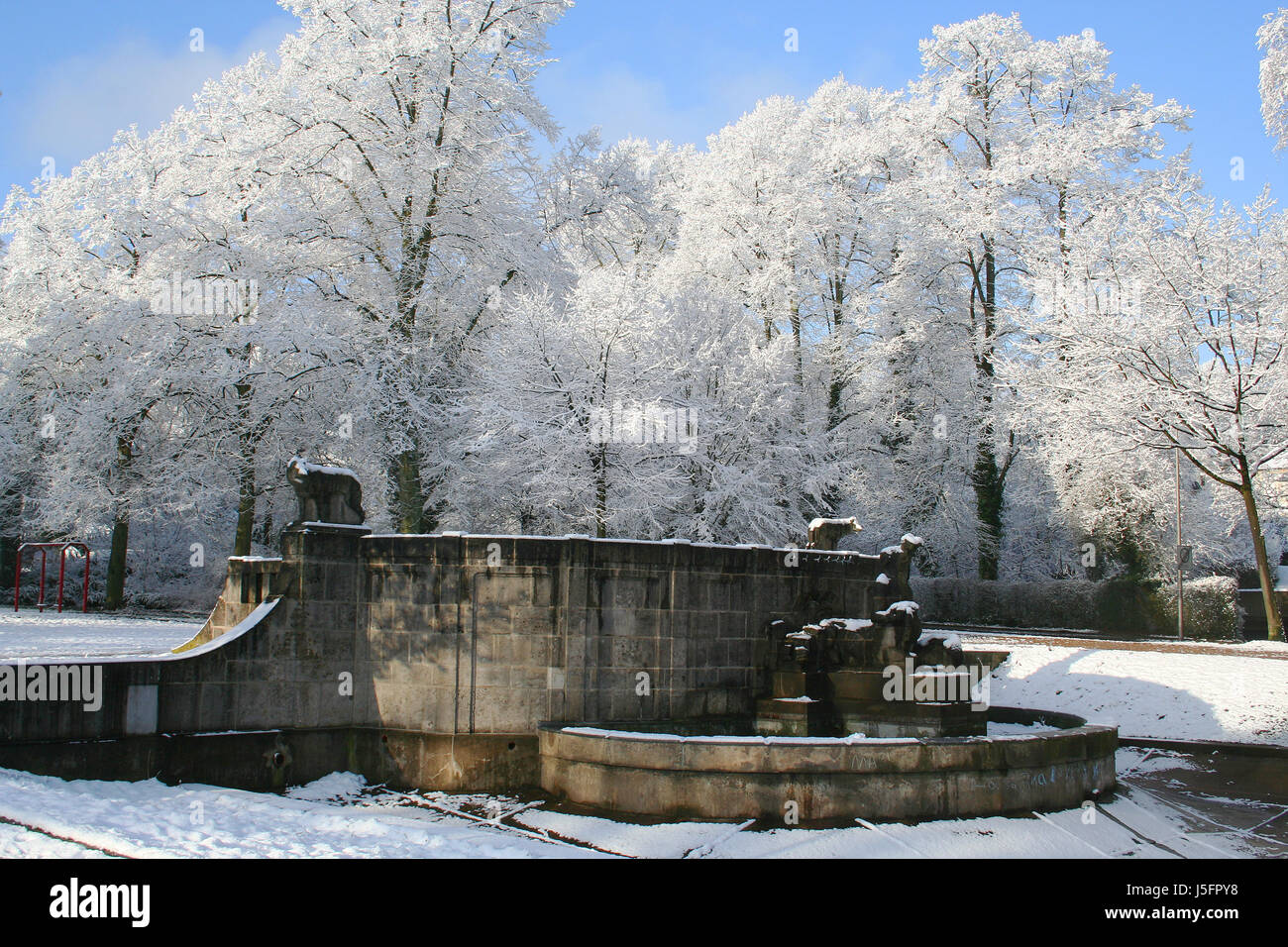 blue tree trees park winter snowy fountain fresh water pond water day ...