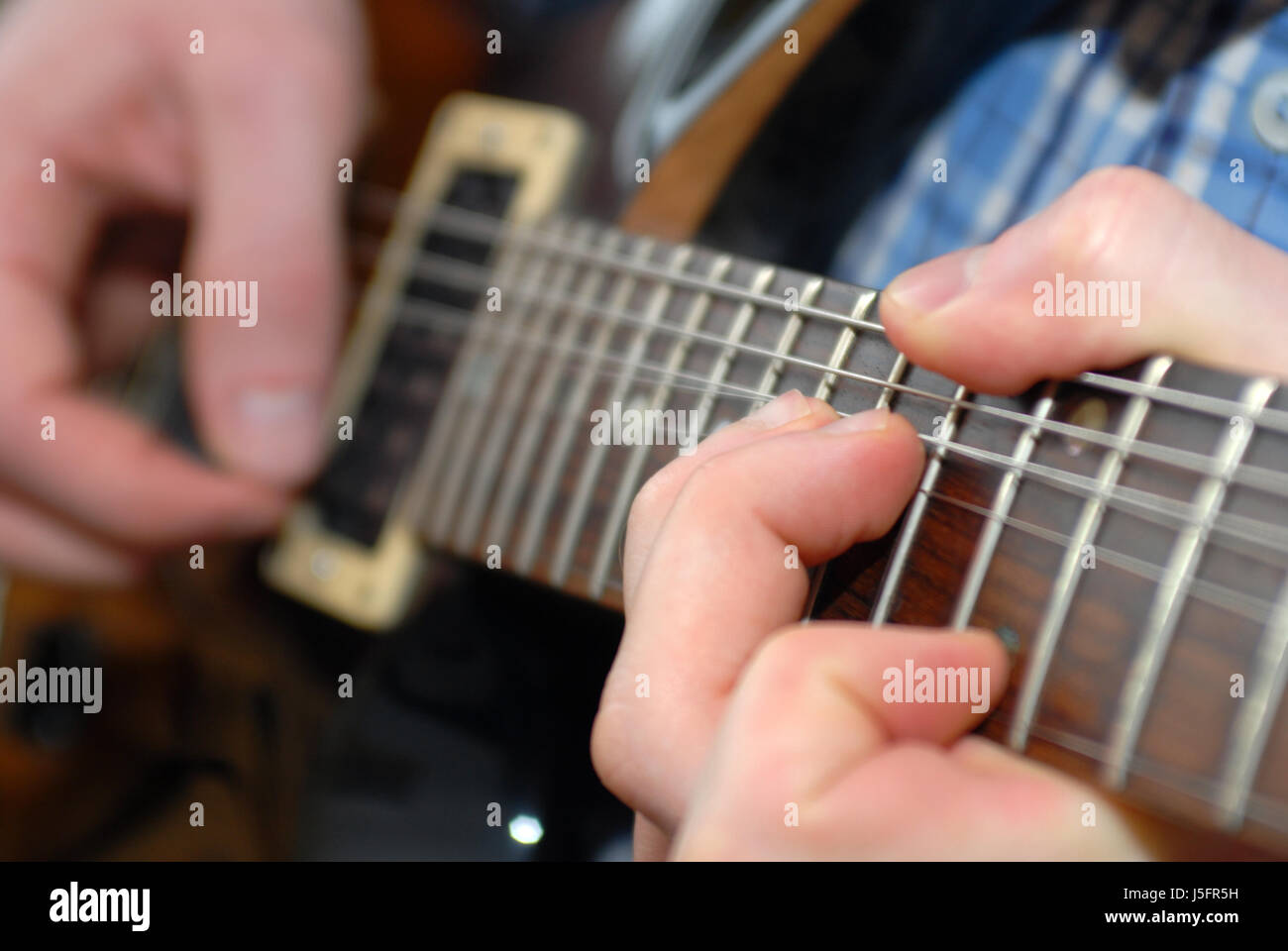 Guitar bending strings hi-res stock photography and images - Alamy