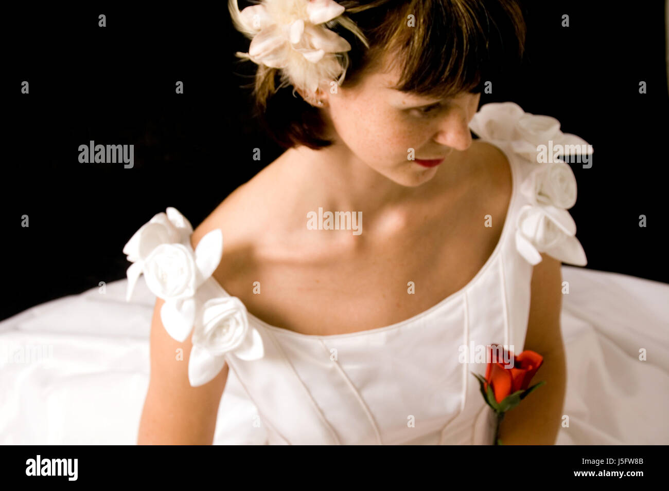 seated bride with rose Stock Photo - Alamy