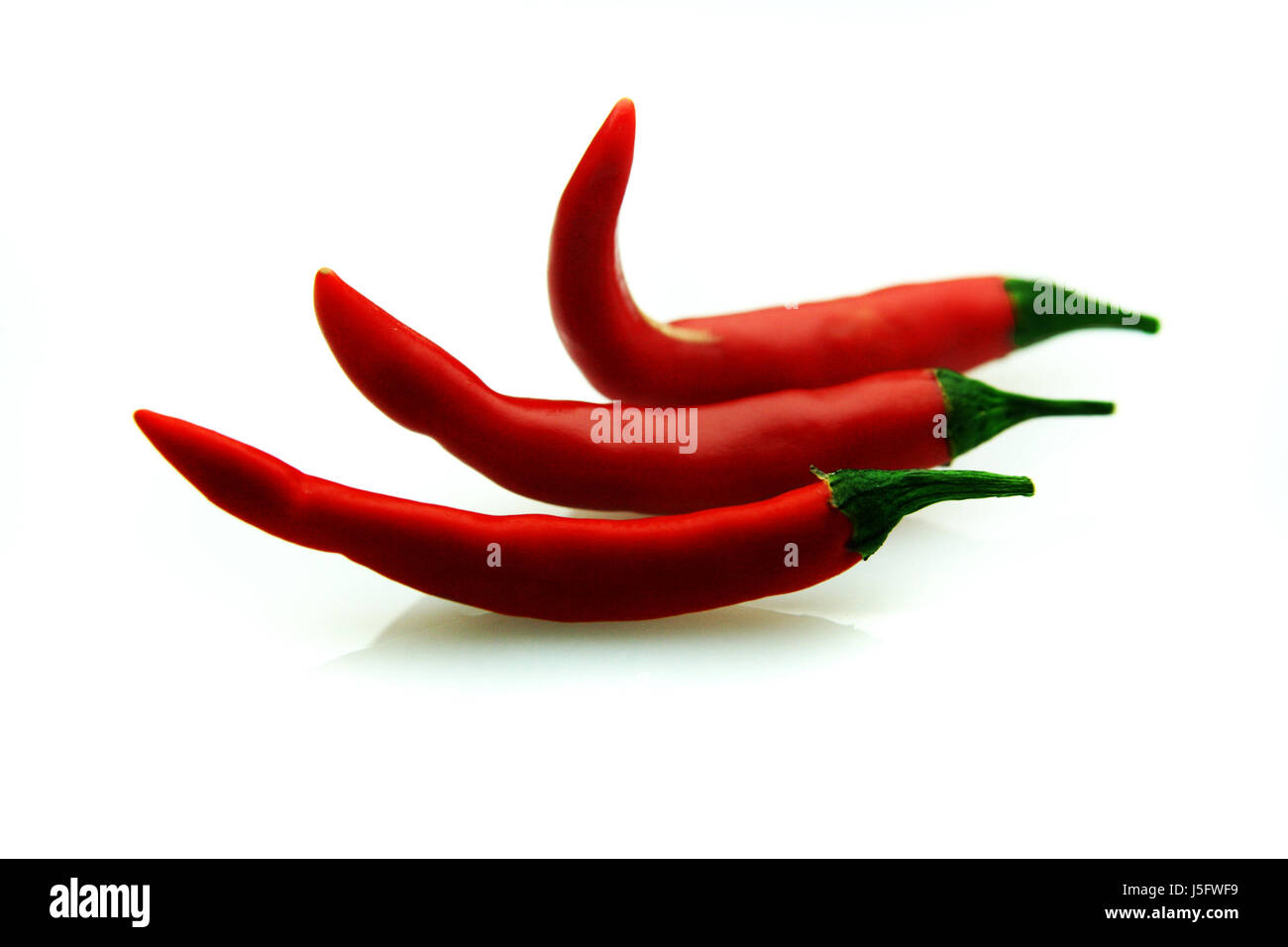 isolated three chilies Stock Photo - Alamy