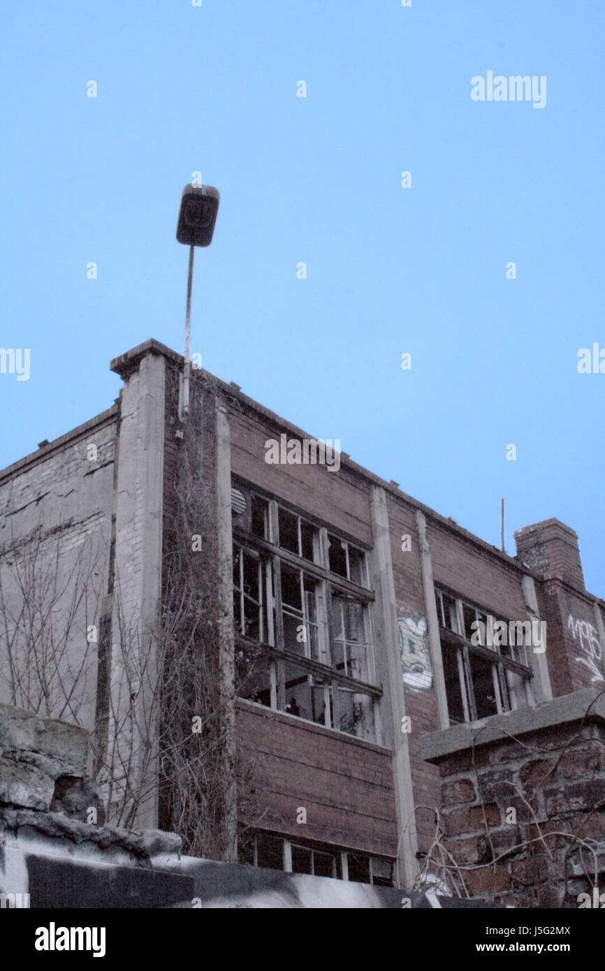 factory ruins against blue background Stock Photo - Alamy