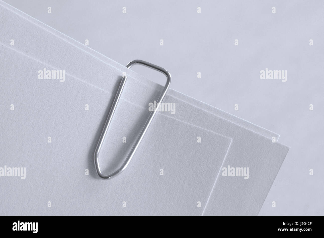 keep together cohesion connect paper clip assemble tack sheet of paper ...