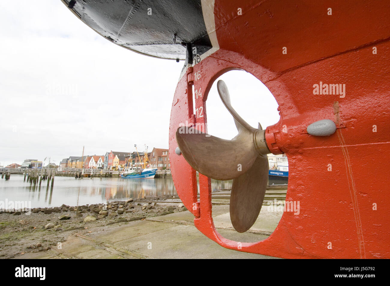 harbor harbours below back rear propeller red building water sailing ...