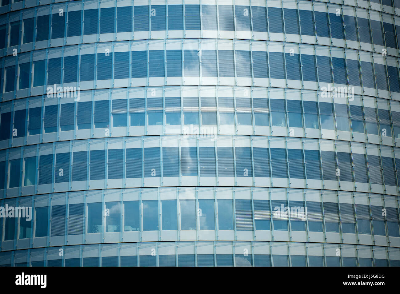 Blue glass wall of a skyscraper Stock Photo - Alamy