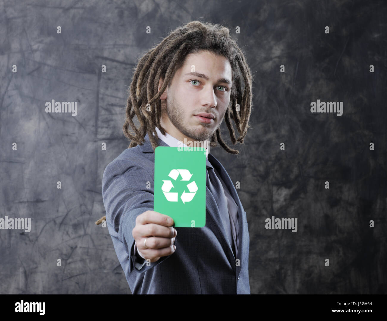 Businessman referee assigning a green card, ecology concept Stock Photo ...