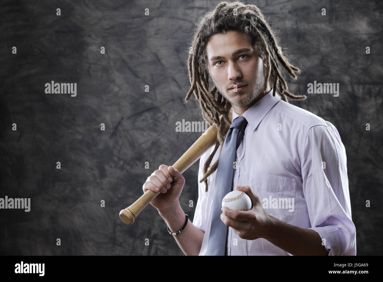 Portrait of young businessman with baseball bat Stock Photo - Alamy