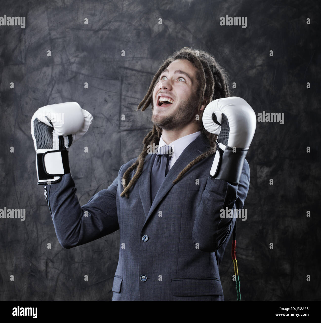 Young businessman shouting his victory, he wearing boxes gloves Stock ...