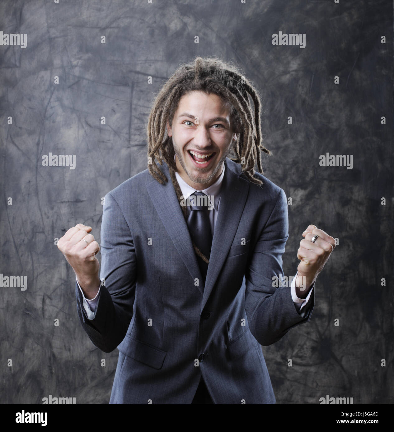 Happy business man celebrates success Stock Photo - Alamy