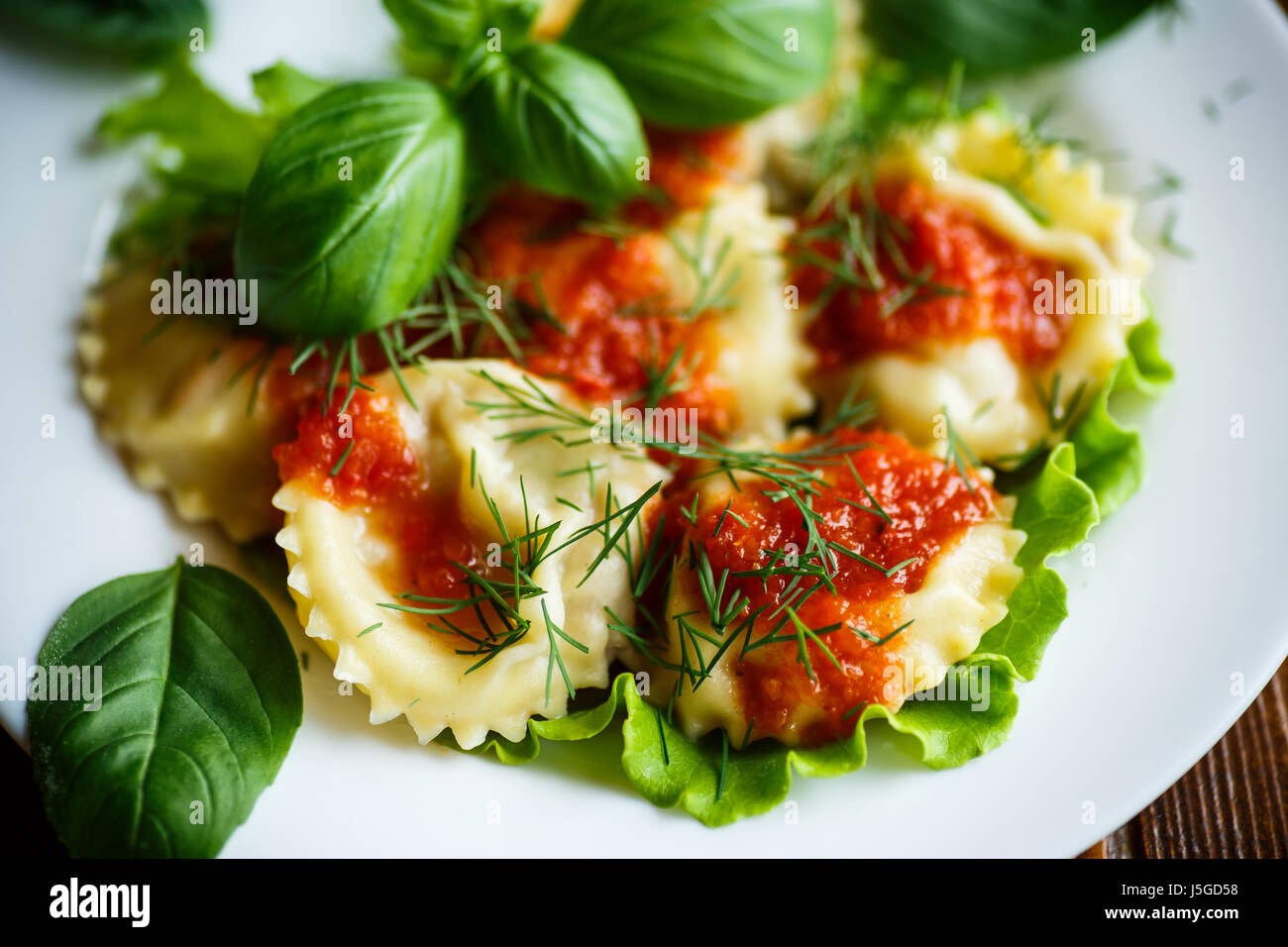 Ravioli with tomato sauce Stock Photo - Alamy