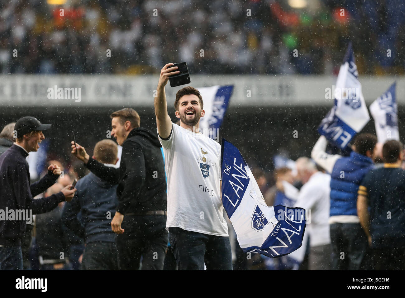 A Tottenham fan takes a selfie as the fans invade the pitch during the ...
