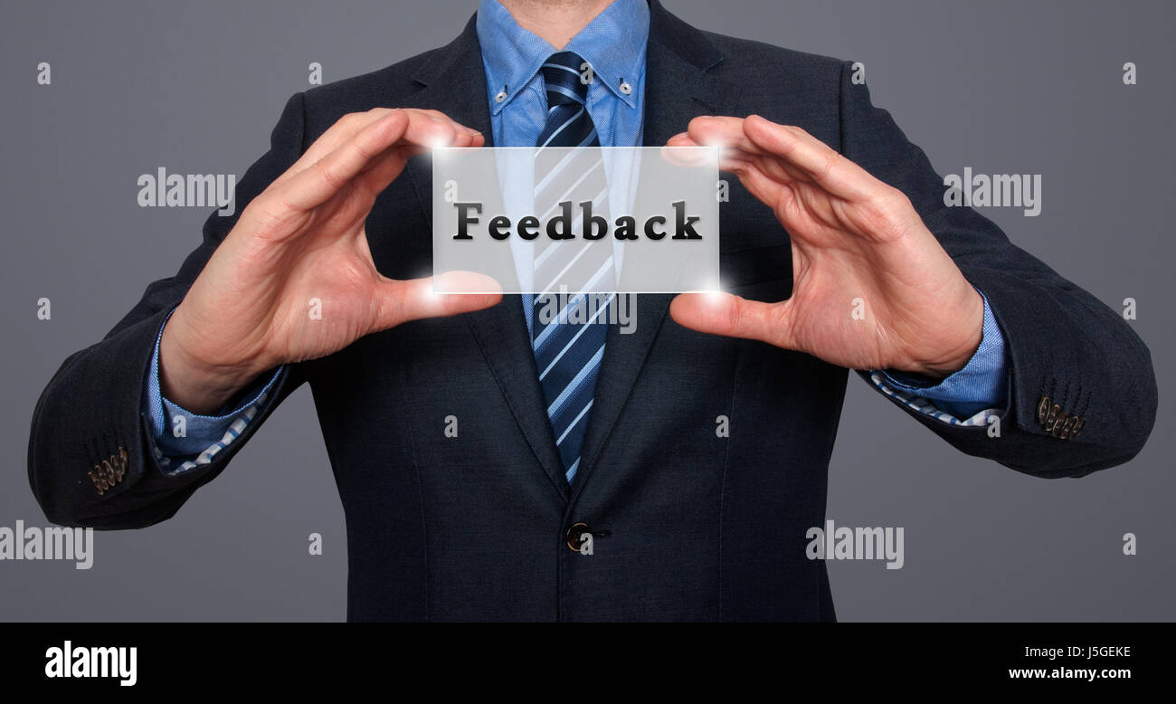 Businessman presenting Feedback concept of his own hands. Grey - Stock ...