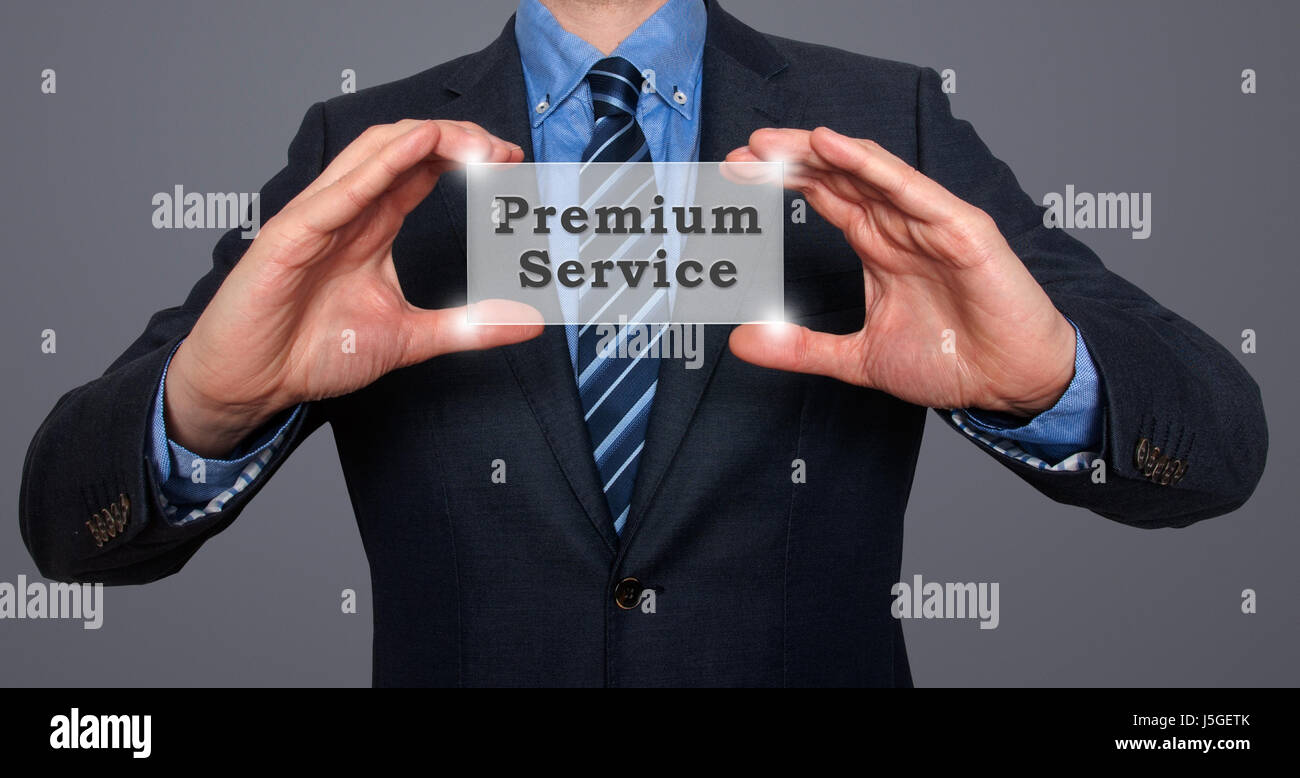 Businessman holds premium service in his hands. Grey - Stock Photo ...