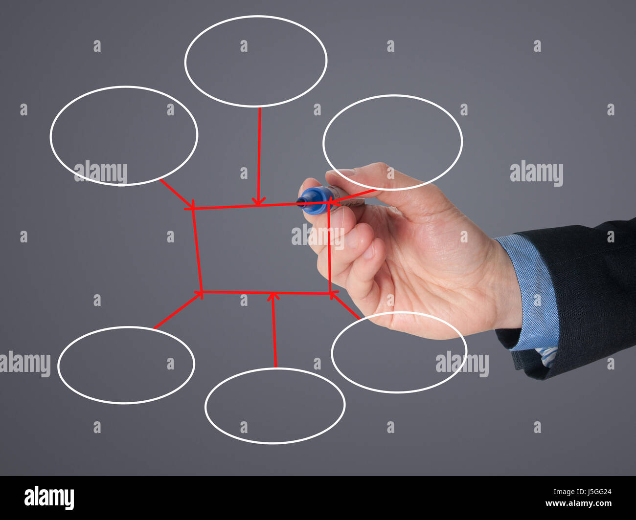 Businessman hand drawing blank flow chart on transparent wipe board ...