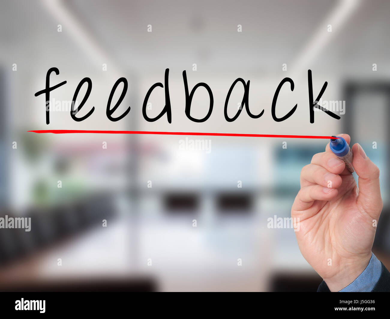 feedback concept with businessman hand writing. Isolated on office ...