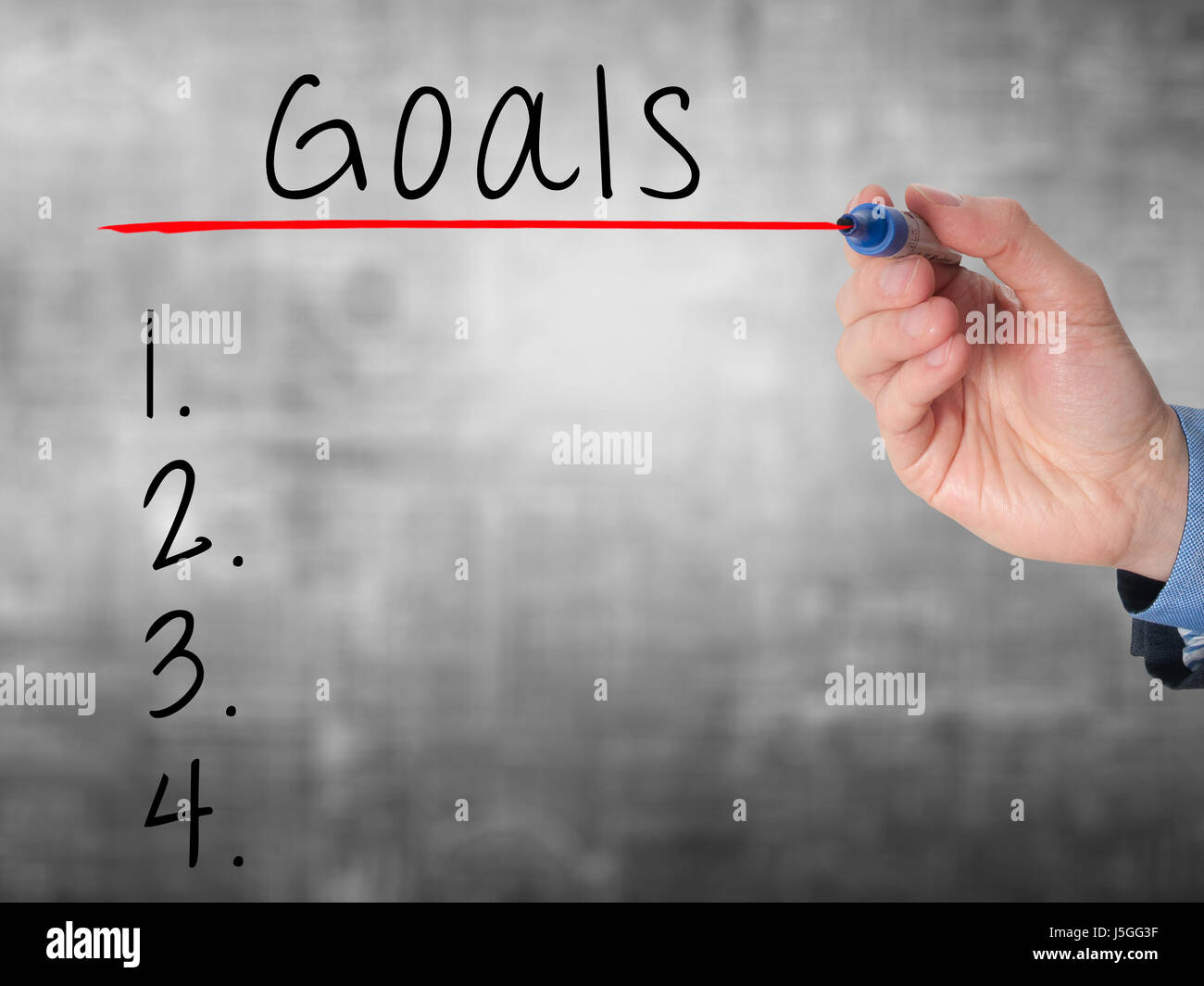 Businessman is writing goals list, planning on whiteboard. Isolated on ...