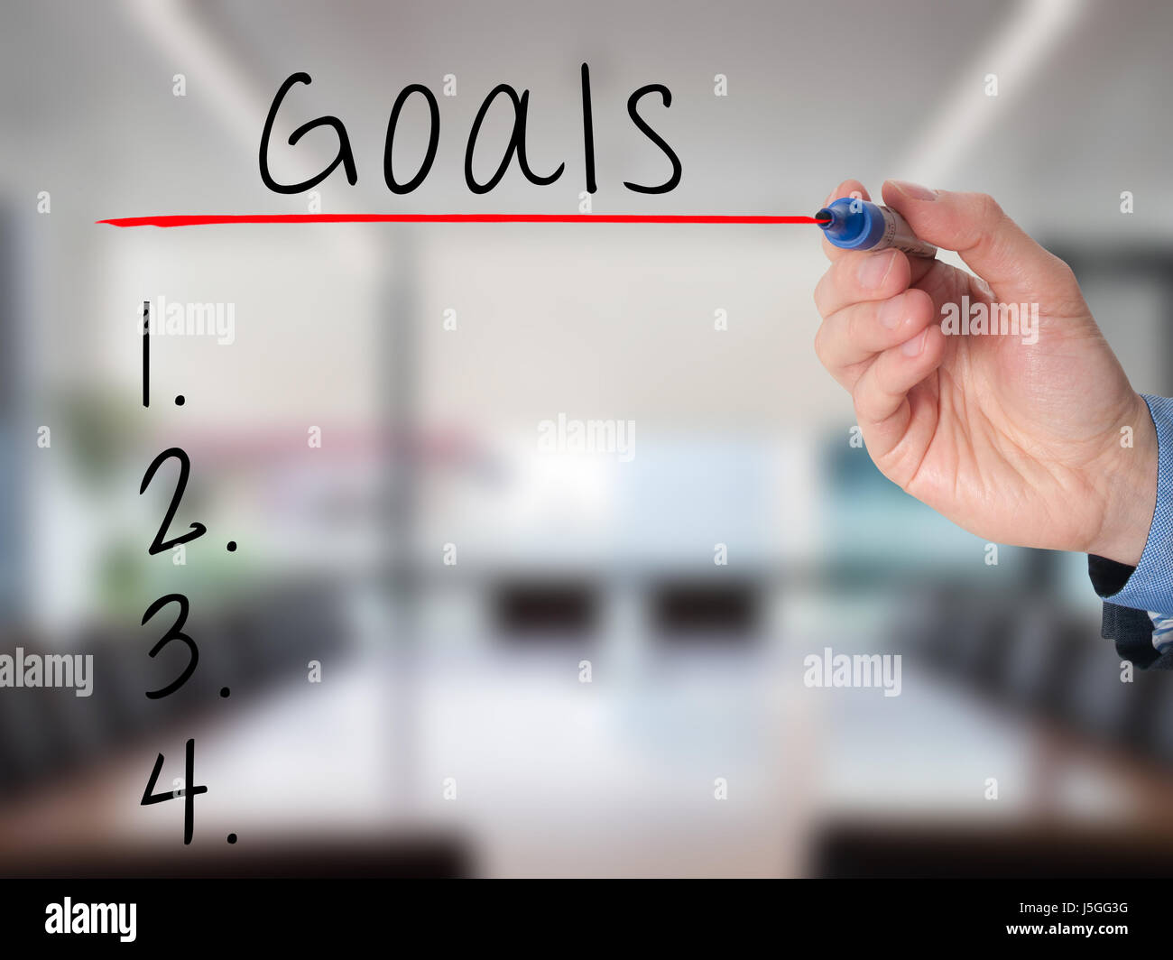 Businessman is writing goals list, planning on whiteboard. Isolated on ...